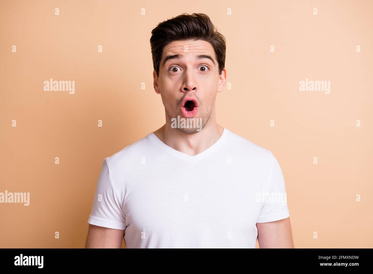 Photo of crazy amazed young man open mouth unbelievable information ...