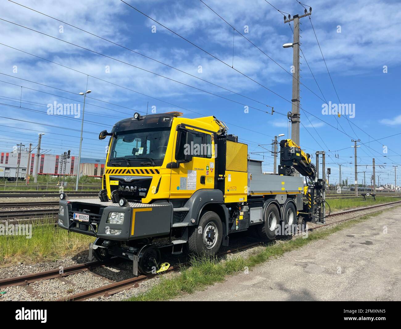 MAN TGS 26.400, two way crane truck at a railway station Stock Photo ...