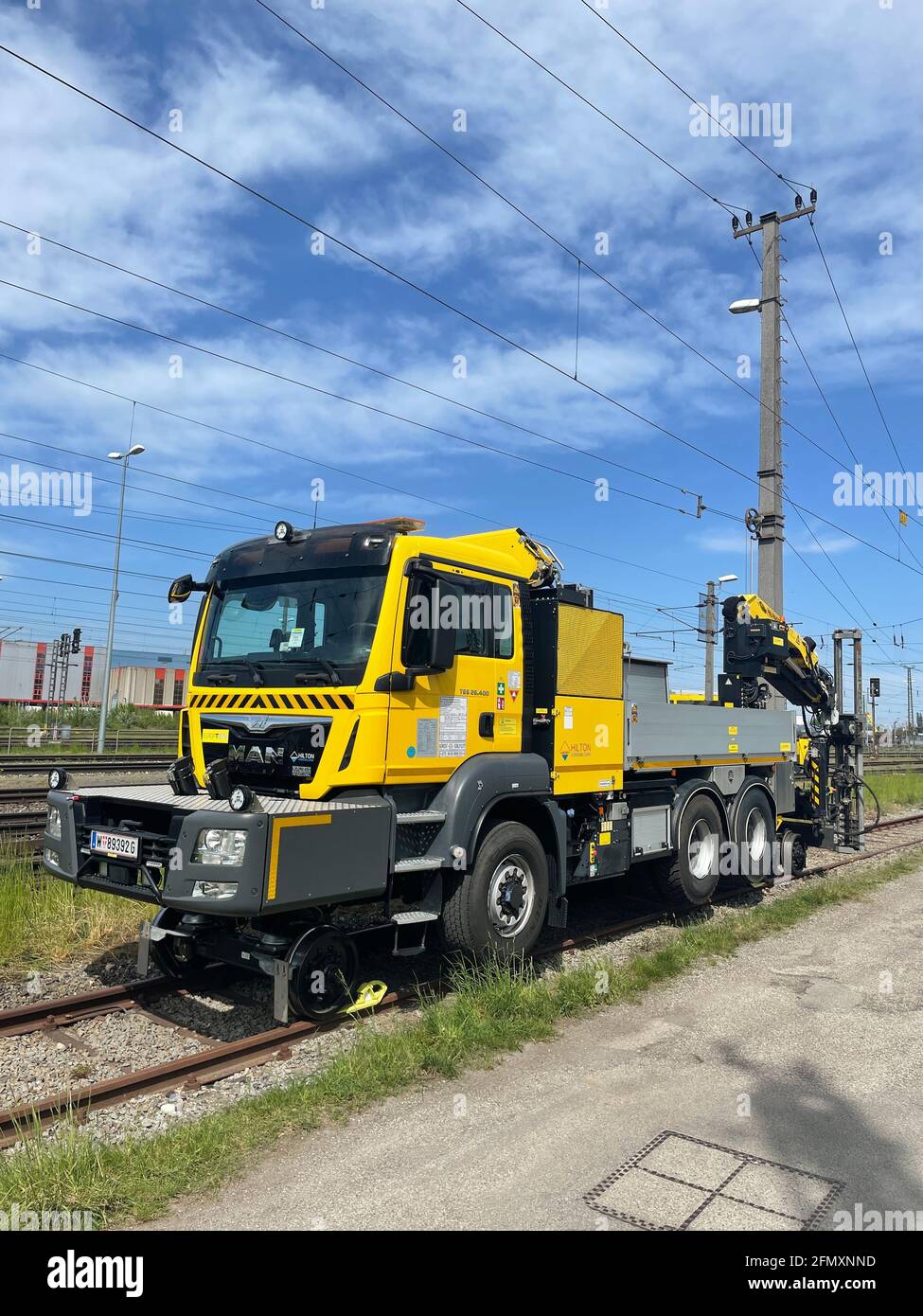 MAN TGS 26.400, two way crane truck at a railway station Stock Photo ...