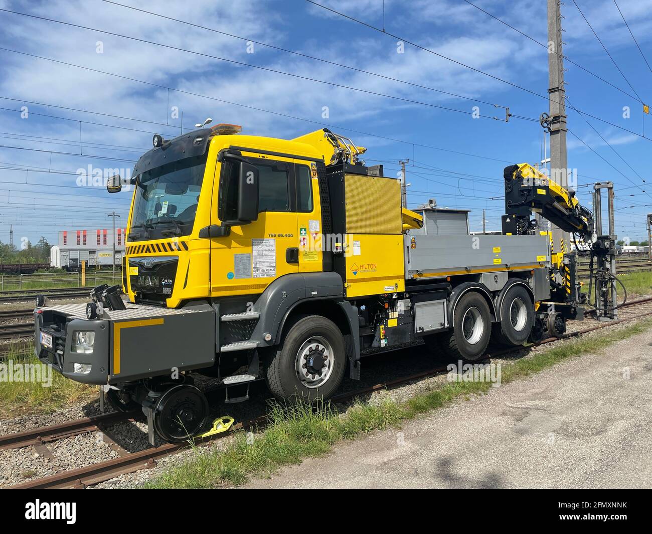 MAN TGS 26.400, two way crane truck at a railway station Stock Photo ...
