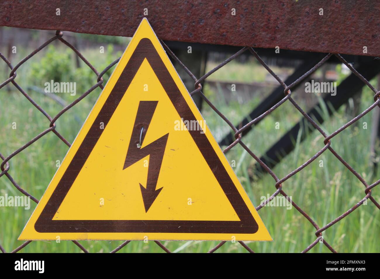 a sign of danger. Dark brown lightning against the yellow triangle ...
