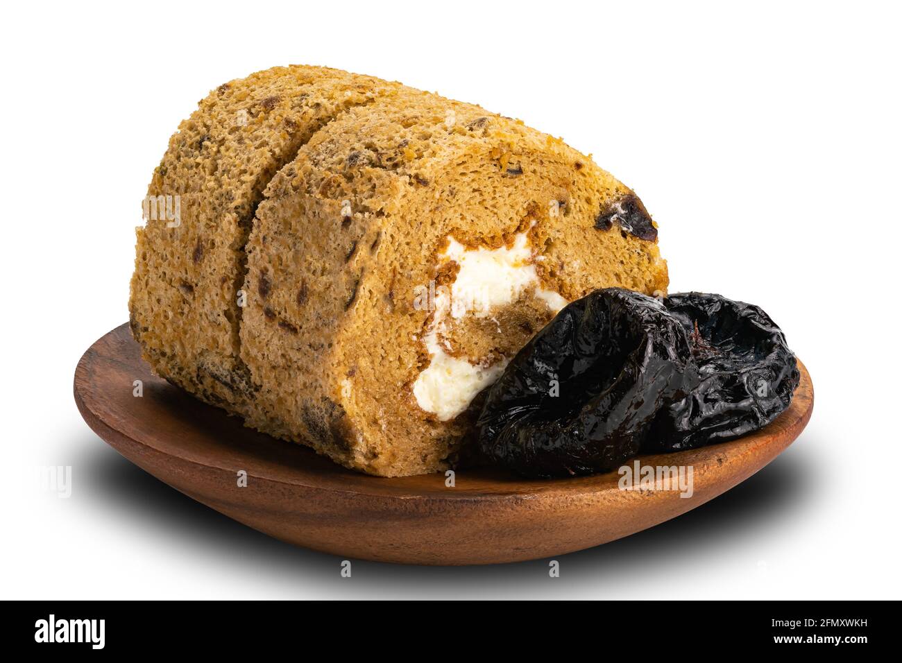 Closeup view of sliced prune sponge cake roll with pittrd dried prune ...