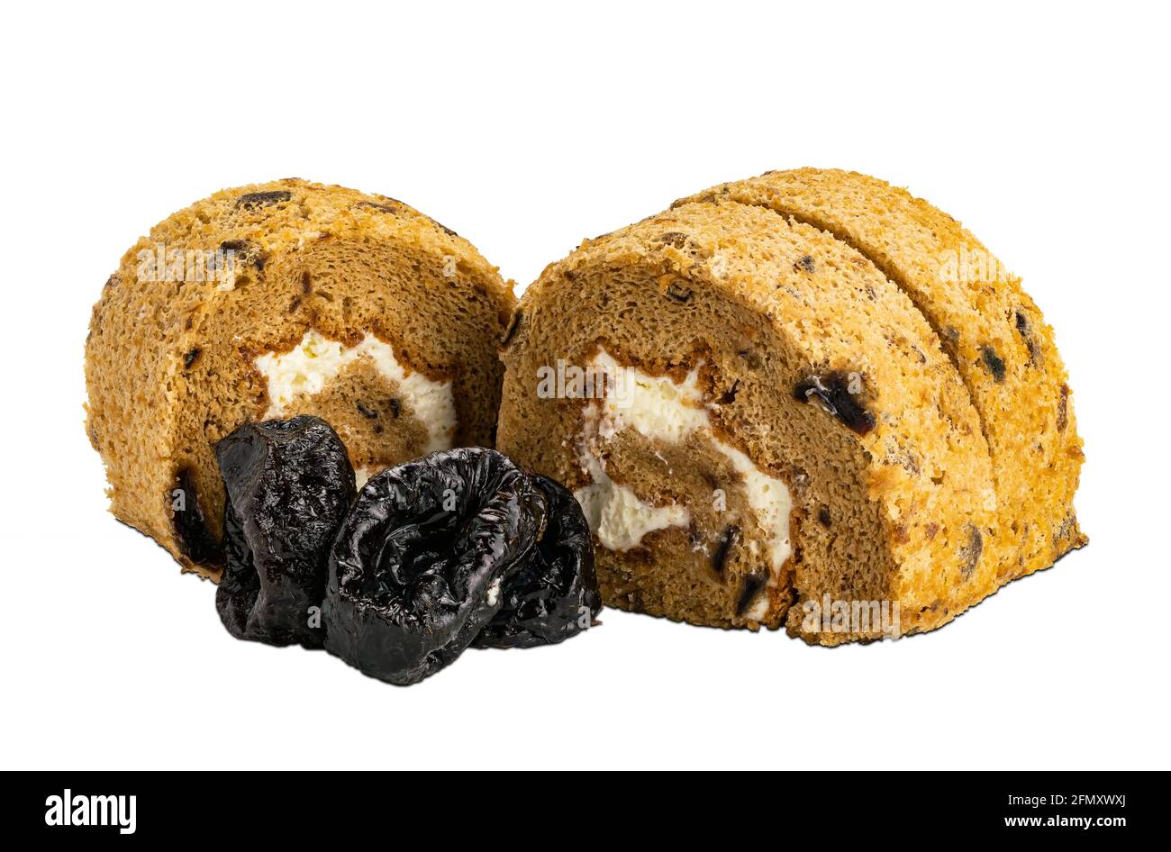 Side view of sliced homemade prune sponge cake roll and pile of dried ...