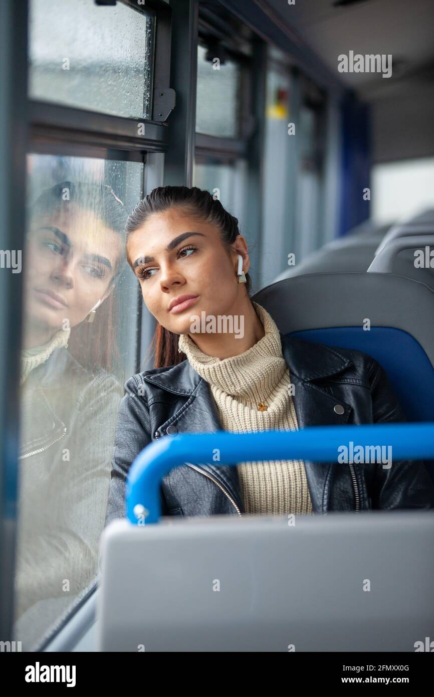Bus passengers looking out of window hi-res stock photography and ...