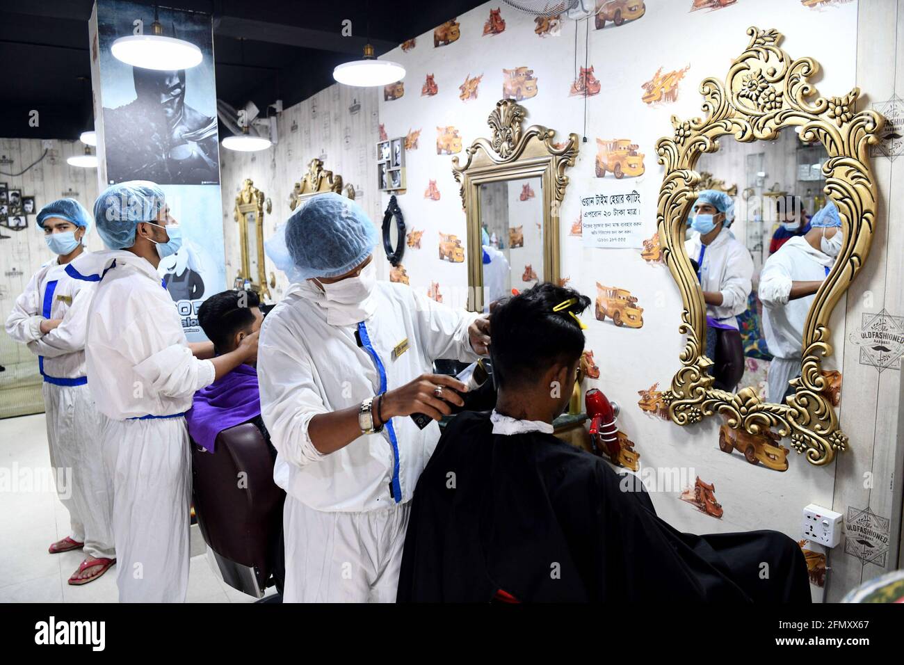 Barbers wearing personal protective equipment (PPE) as a preventive ...