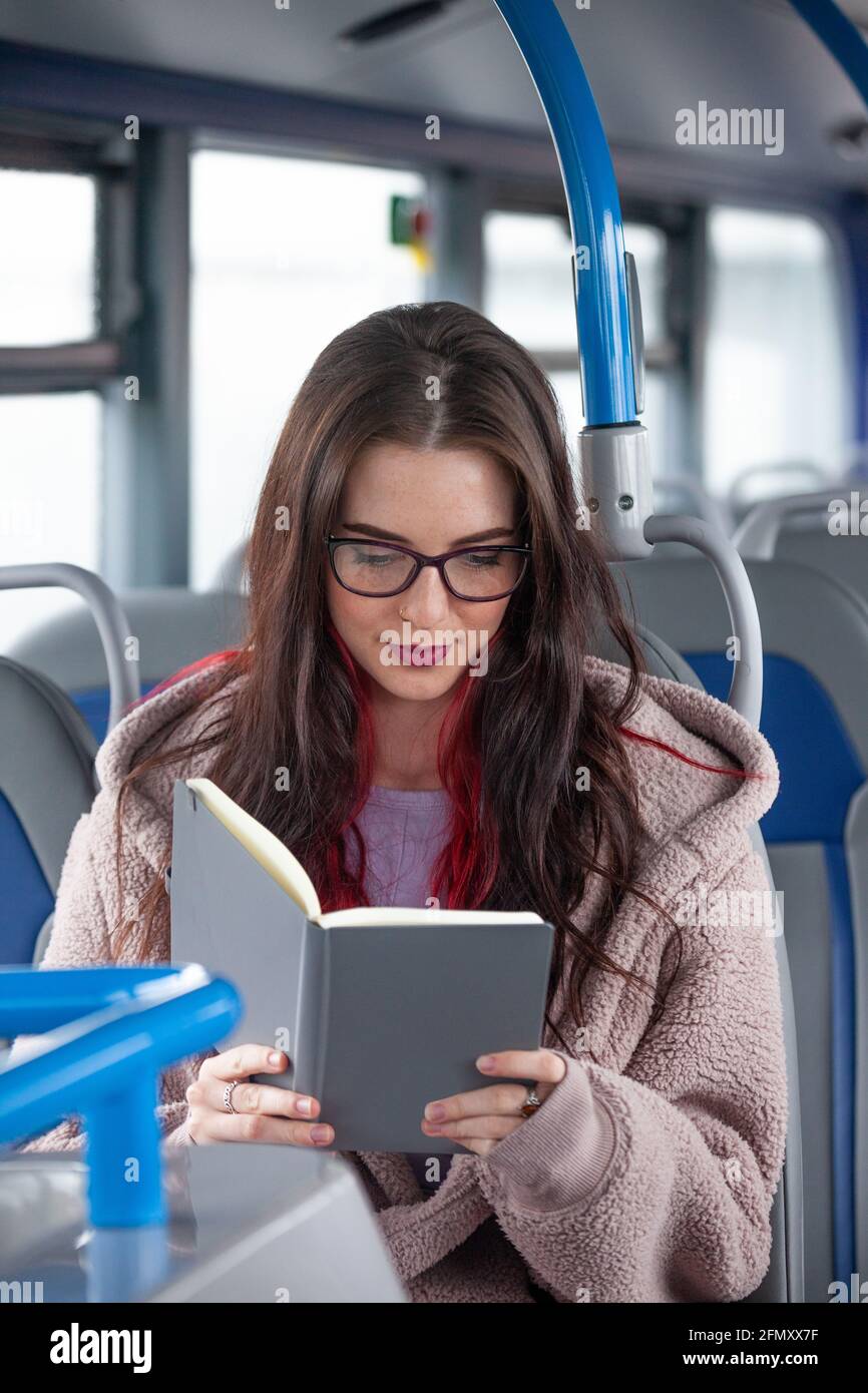 Book on bus hi-res stock photography and images - Alamy