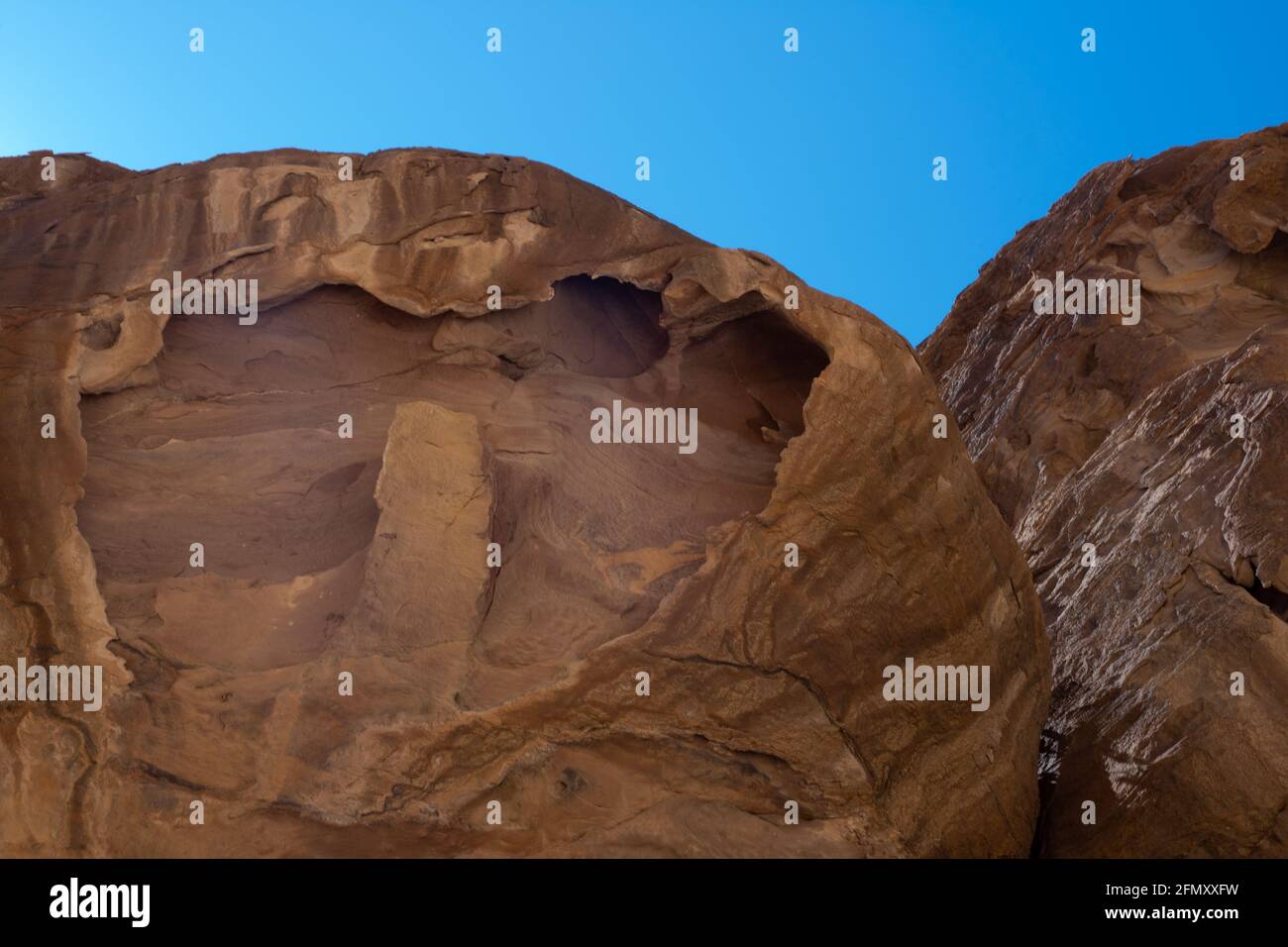 Multicolored red-rose sandstone with signs of weathering and erosion ...