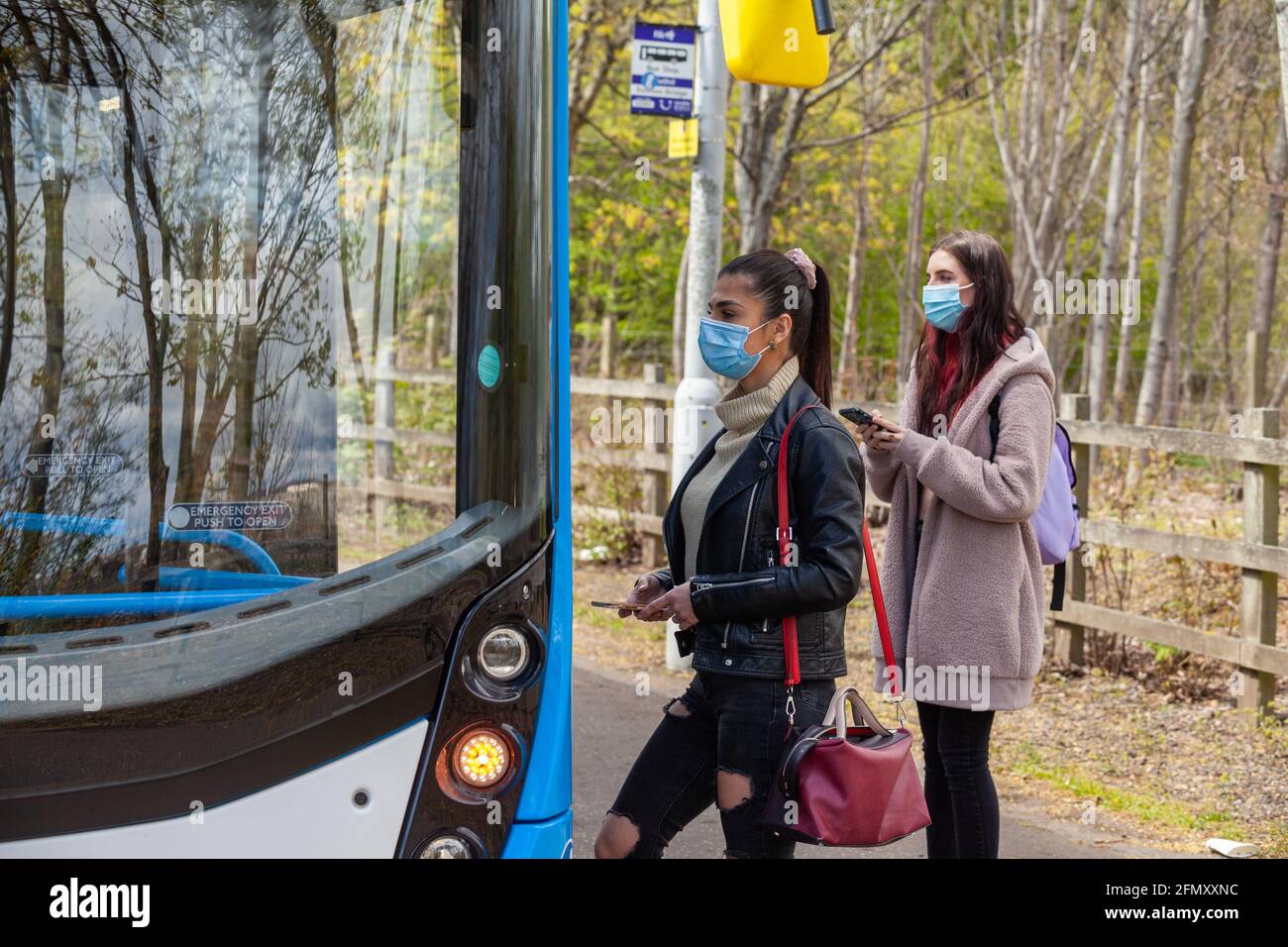 Women waiting at the bus stop hi-res stock photography and images - Alamy