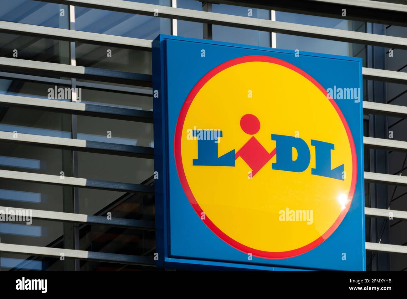 Lidl supermarket logo sign on modern store facade. Lidl is popular ...
