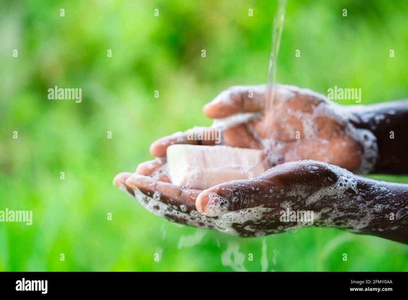 African man washing hands hi-res stock photography and images - Alamy