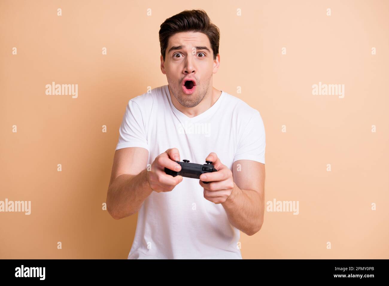 Photo of impressed young guy gamer open mouth yelling excited game ...