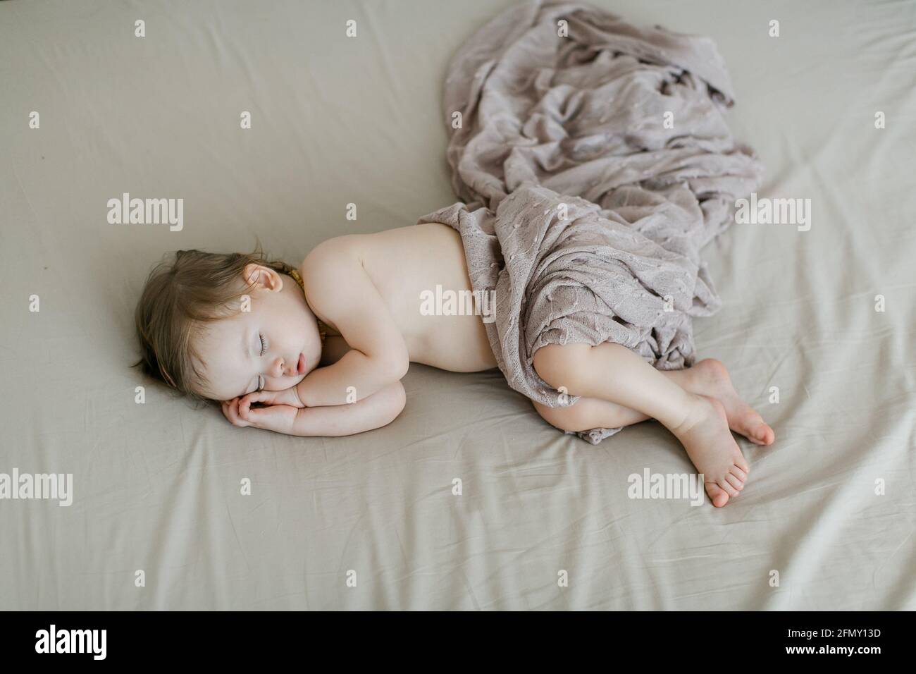 cute infant baby girl sleeping in bed. top view Stock Photo - Alamy