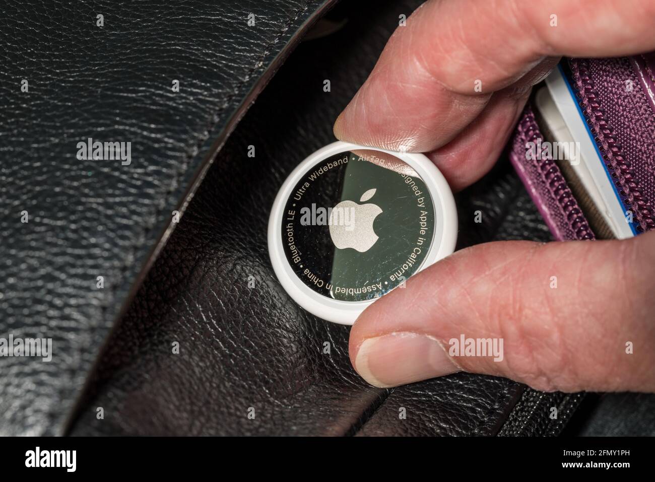 Hiding apple airtag tracking device hi-res stock photography and images ...