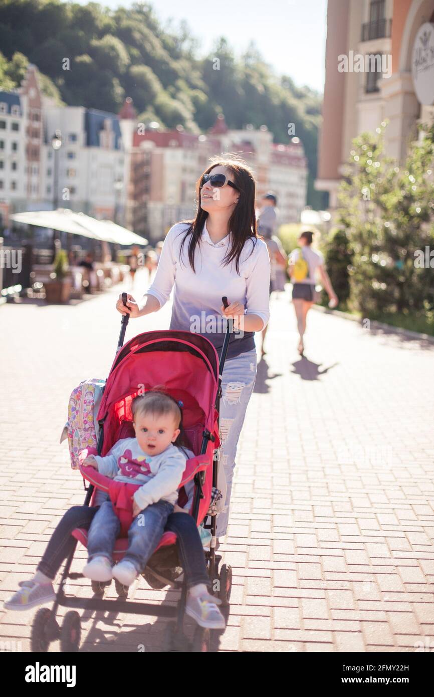 Baby mother hand in hand walk hi-res stock photography and images - Alamy