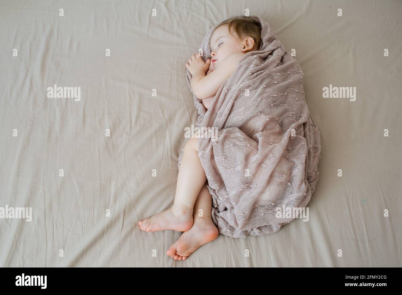 cute infant baby girl sleeping in bed. top view Stock Photo - Alamy
