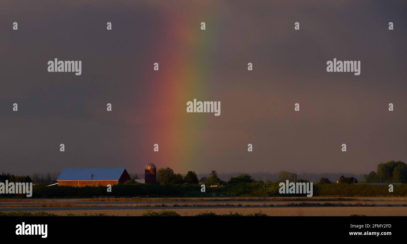 Rainbow over Barn Stock Photo - Alamy