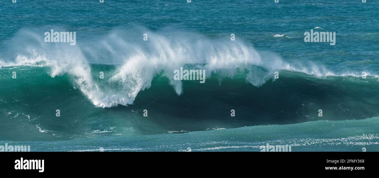 A panoramic image of a large wave breaking on the Cribbar Reef in ...