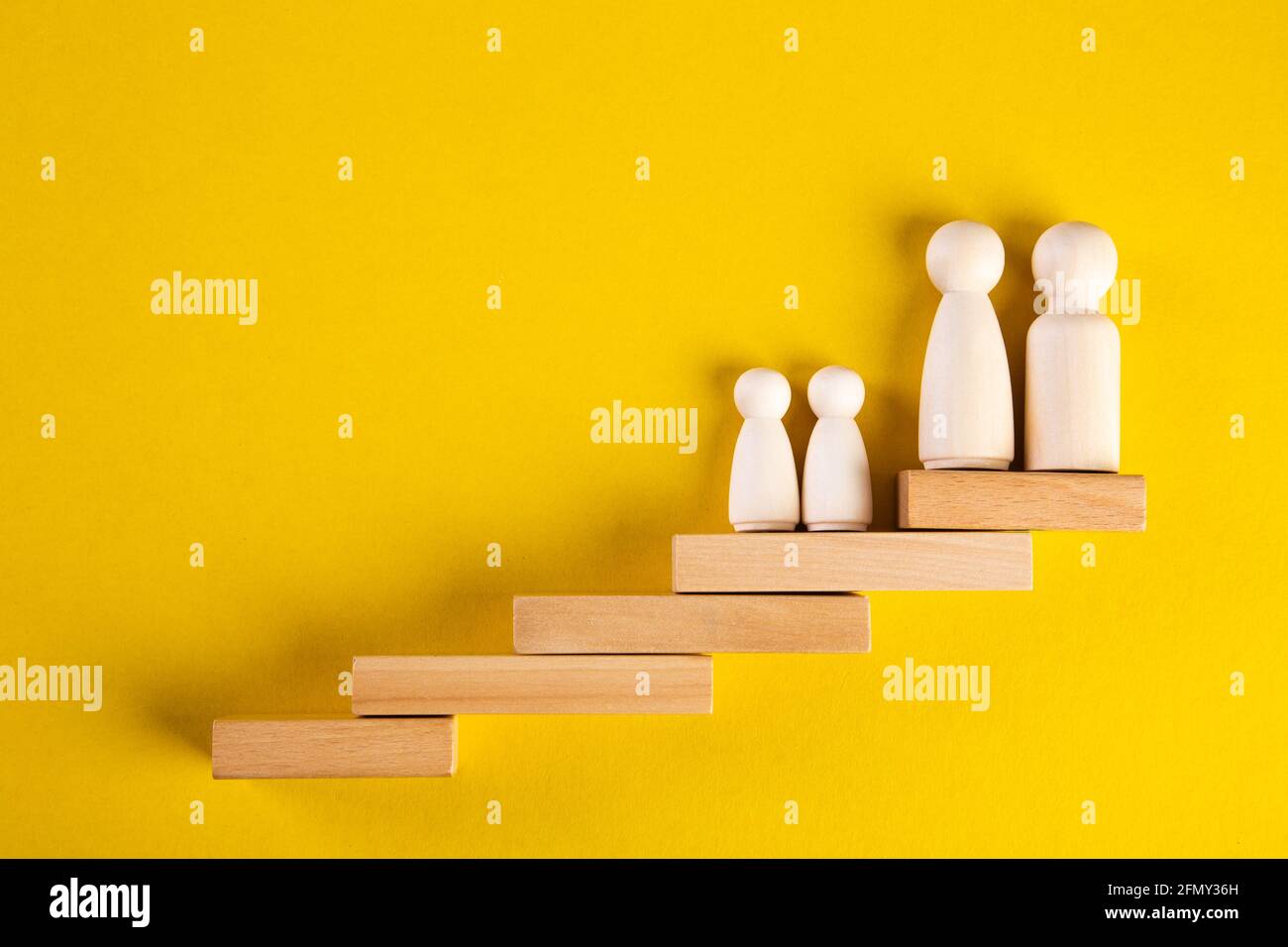 Family made of wooden peg. Family insurance protection onceptual Stock ...