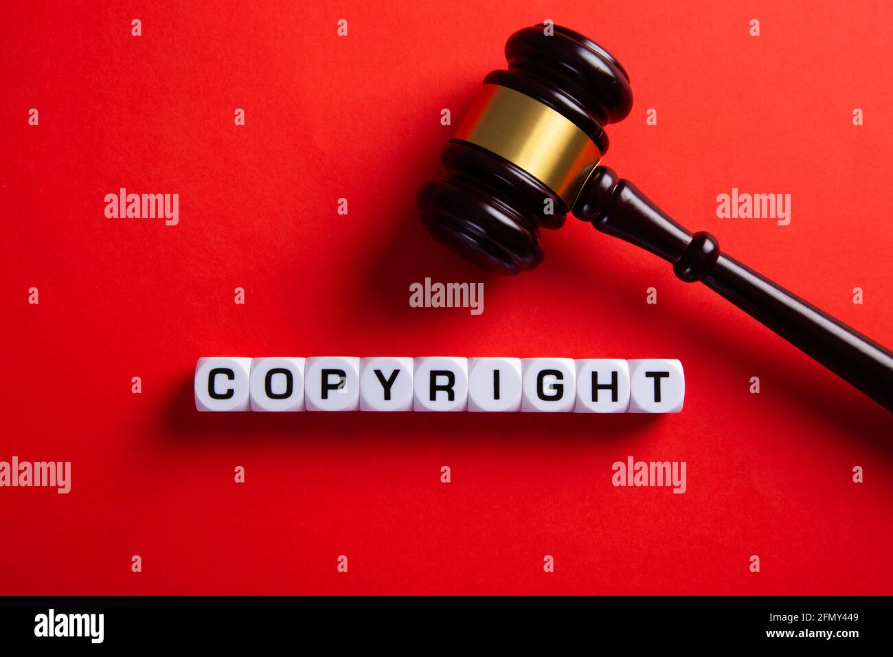 Copyright word and a judge gavel on red background. Concept of legal ...