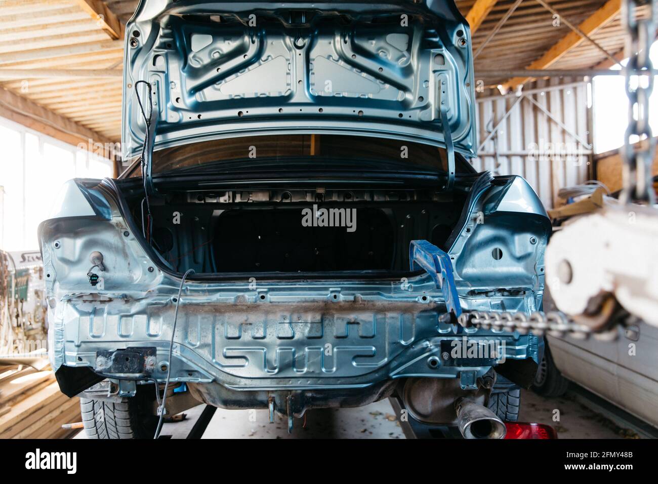 Car has dented rear bumper damaged after accident. Pulling auto body ...