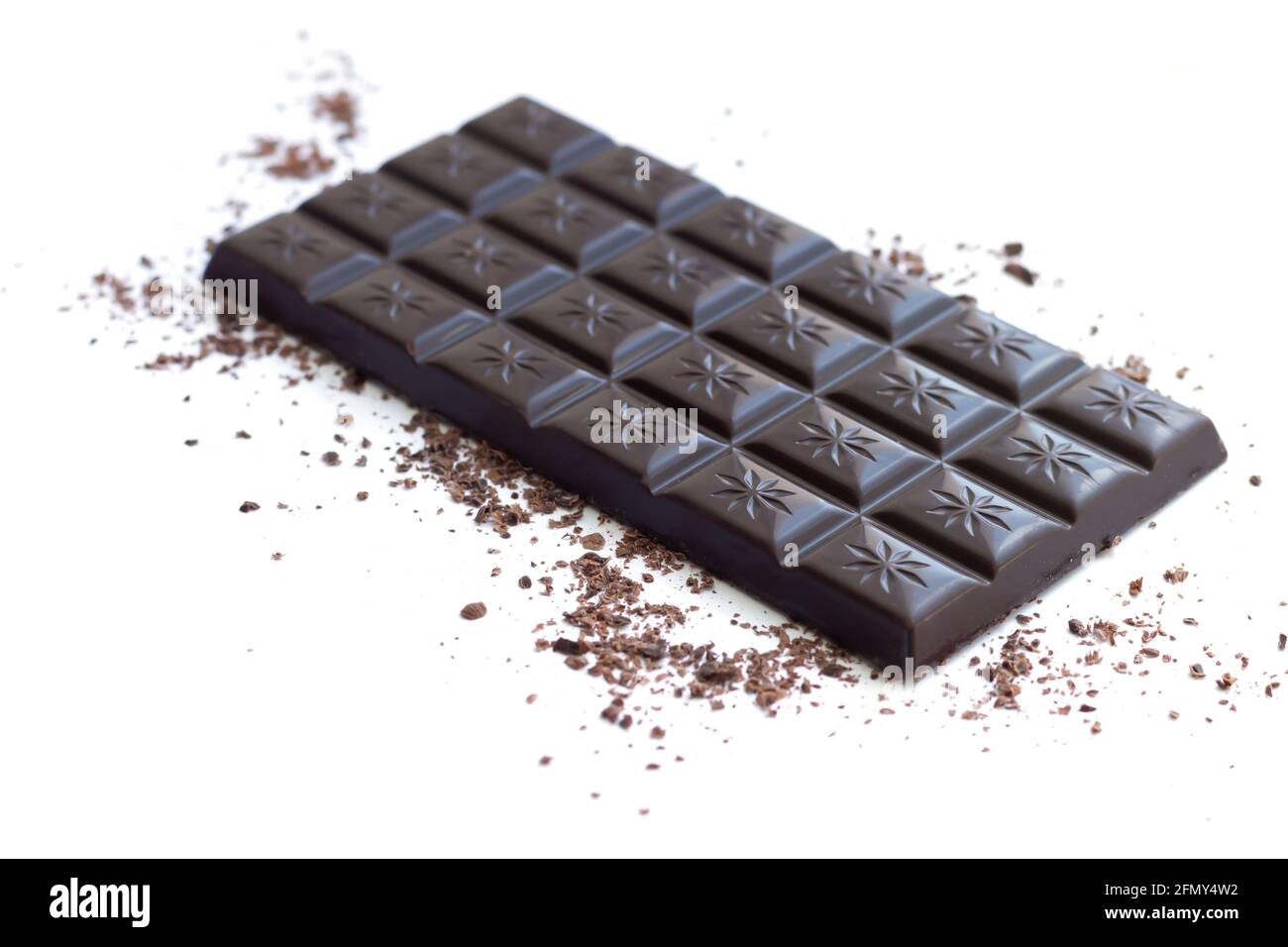 Dark chocolate bar with shavings and powder isolated on white ...