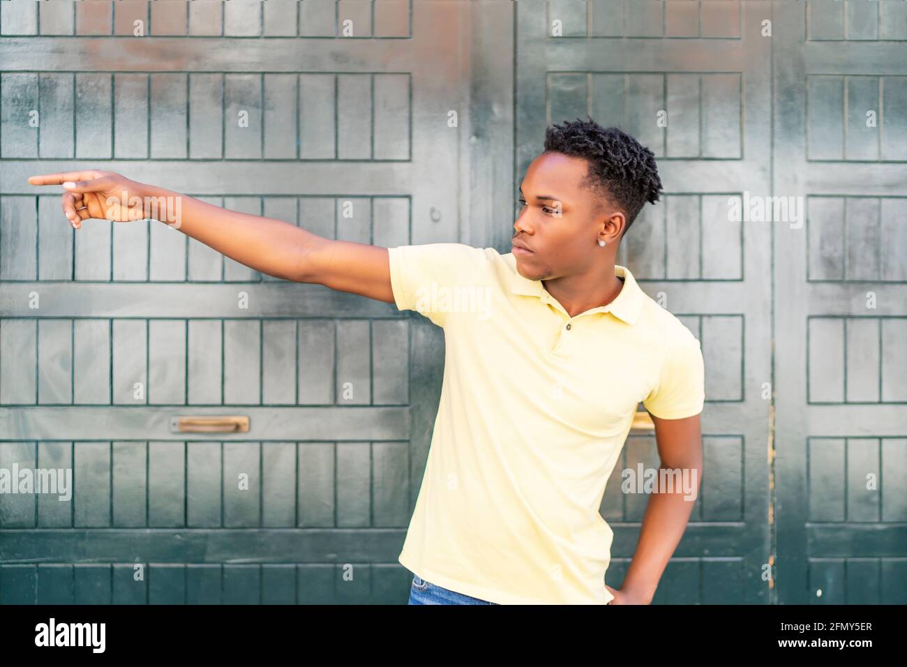 young african man pointing in a direction Stock Photo - Alamy