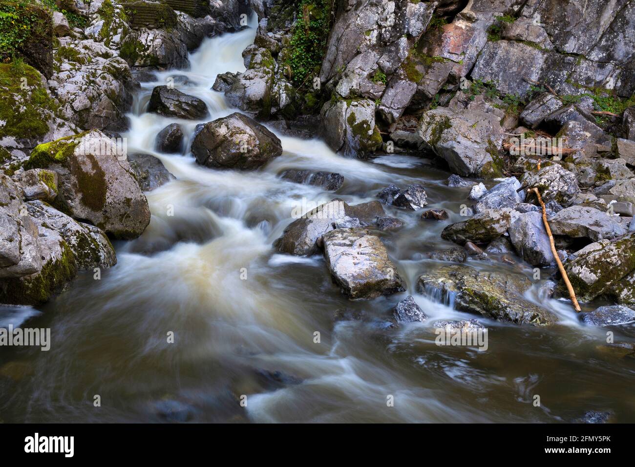 The Pwll y berw river after heavy rainfall at Dinas rock in the neath ...