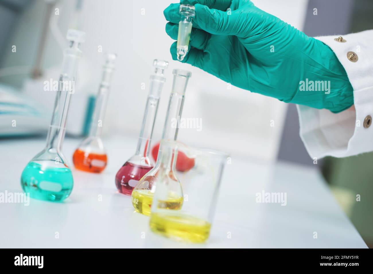 Hands of a chemical laboratory employee with test tubes close-up Stock ...