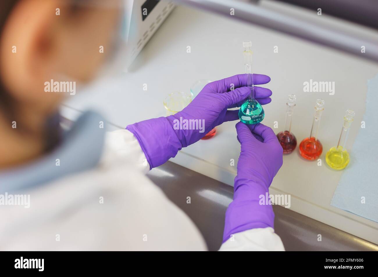 Hands of a chemical laboratory employee with test tubes close-up Stock ...