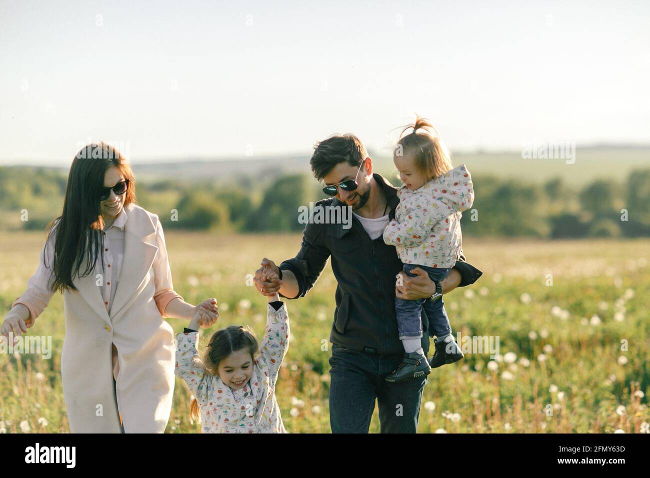 Portrait Of Happy Family In outdoor. sunset Stock Photo - Alamy