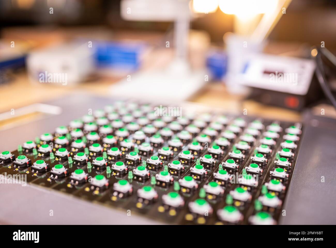 Close-up of a LED panel of green light indicators is in the production ...