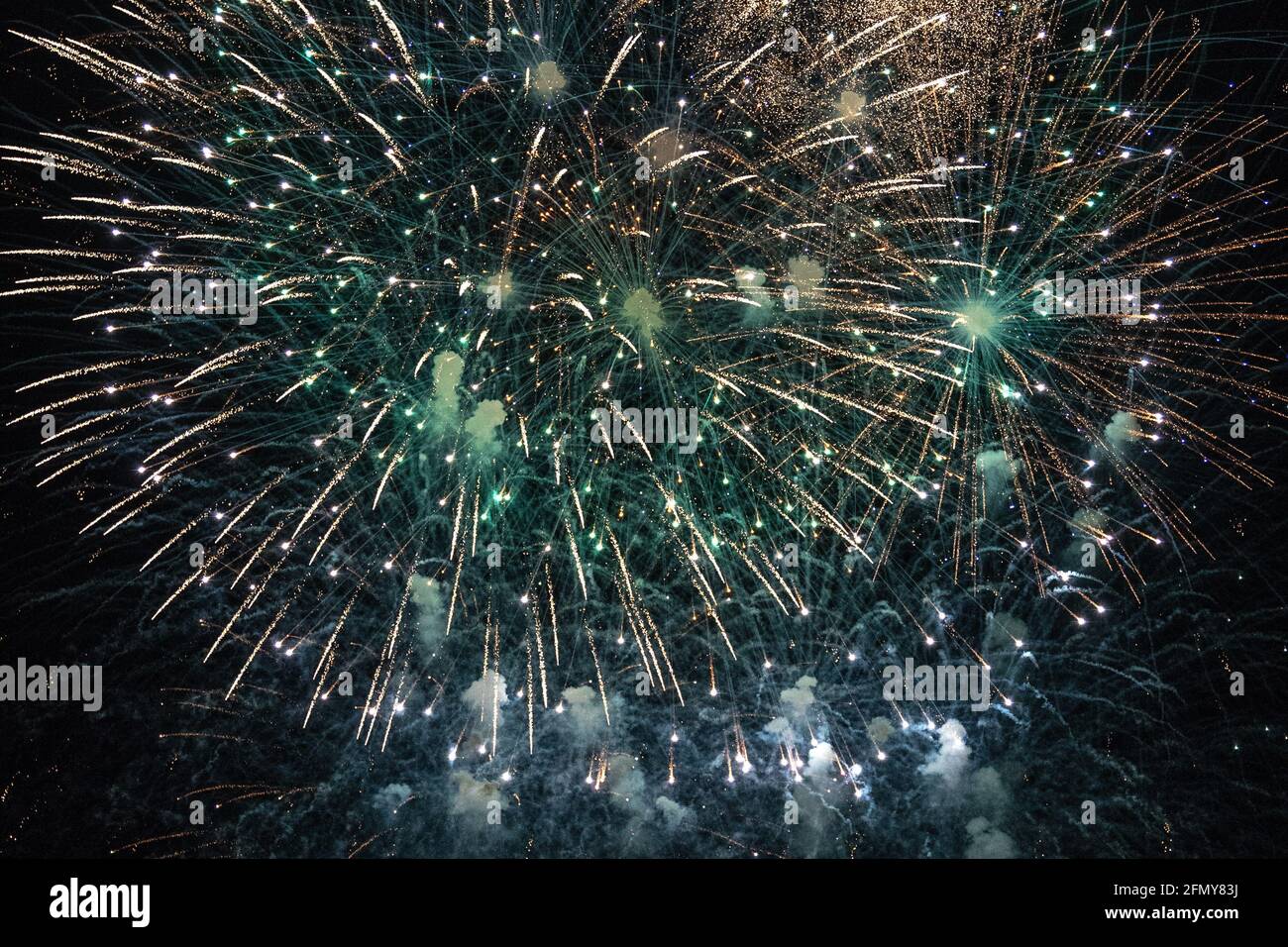 Bunch of colorful exploding fireworks in a night sky Stock Photo - Alamy