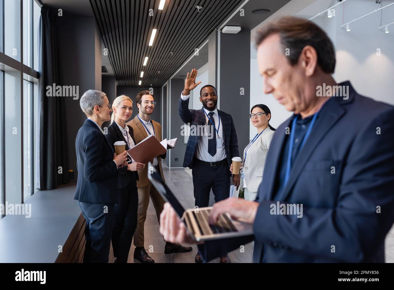 Waving hand to colleagues hi-res stock photography and images - Alamy