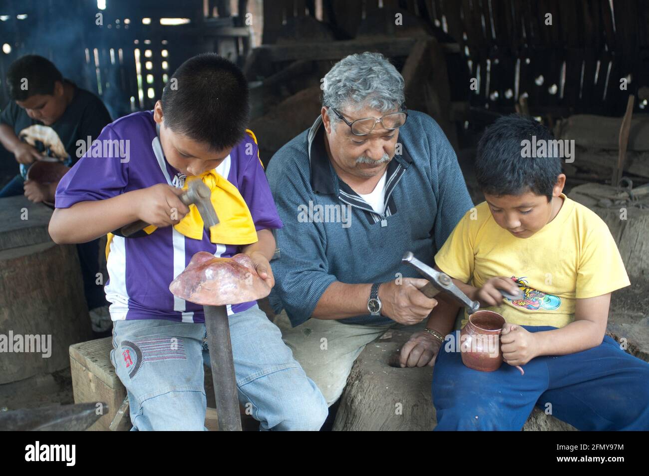 Apprentice children of copper crafts Stock Photo - Alamy