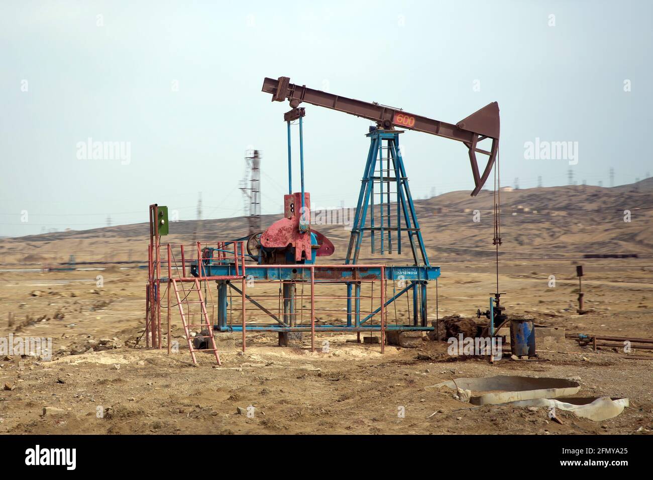 Oil and gas drilling rig onshore dessert with dramatic cloudscape ...