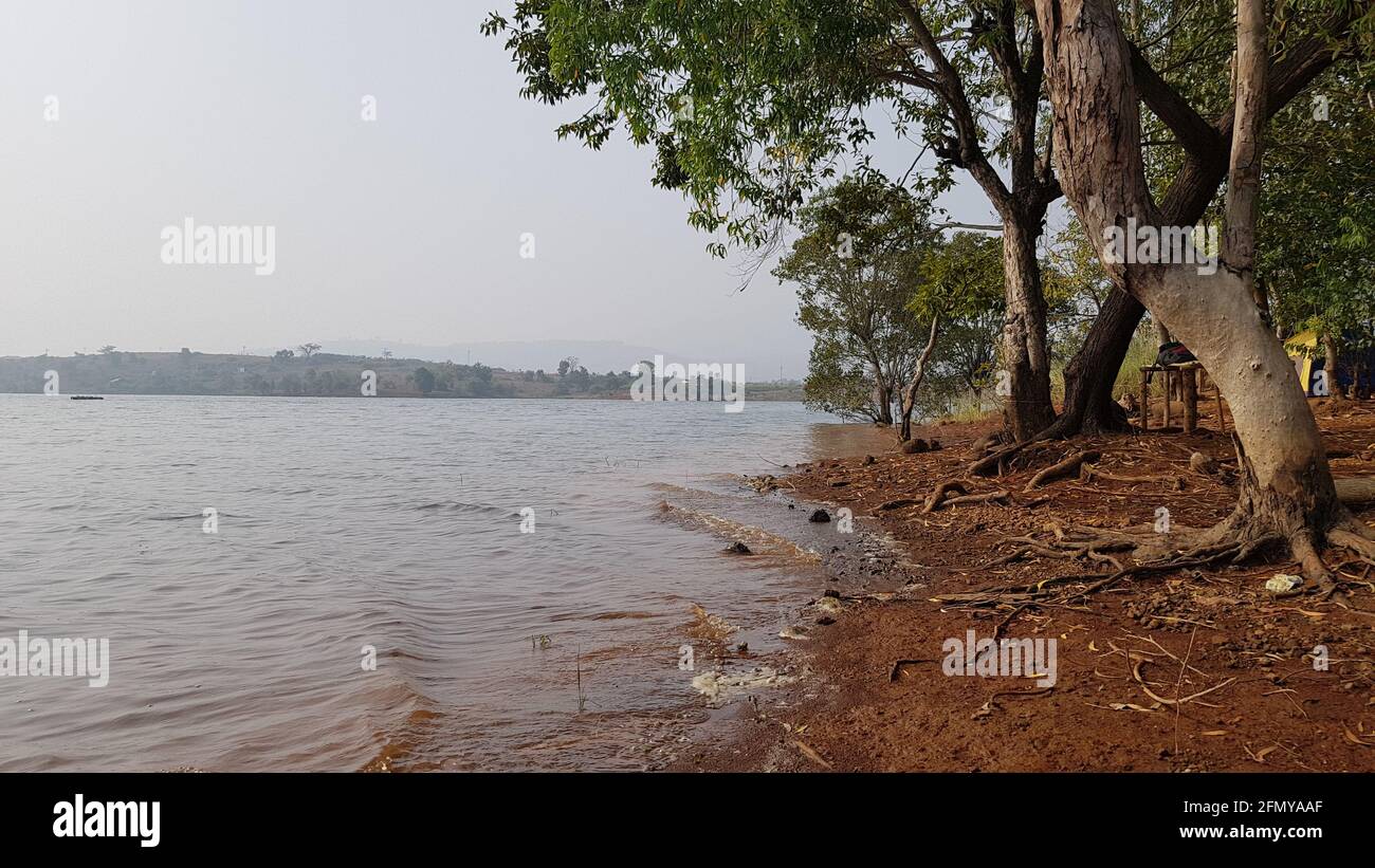 Pavana lake side view on a winter noon. Pavana lake is located in ...