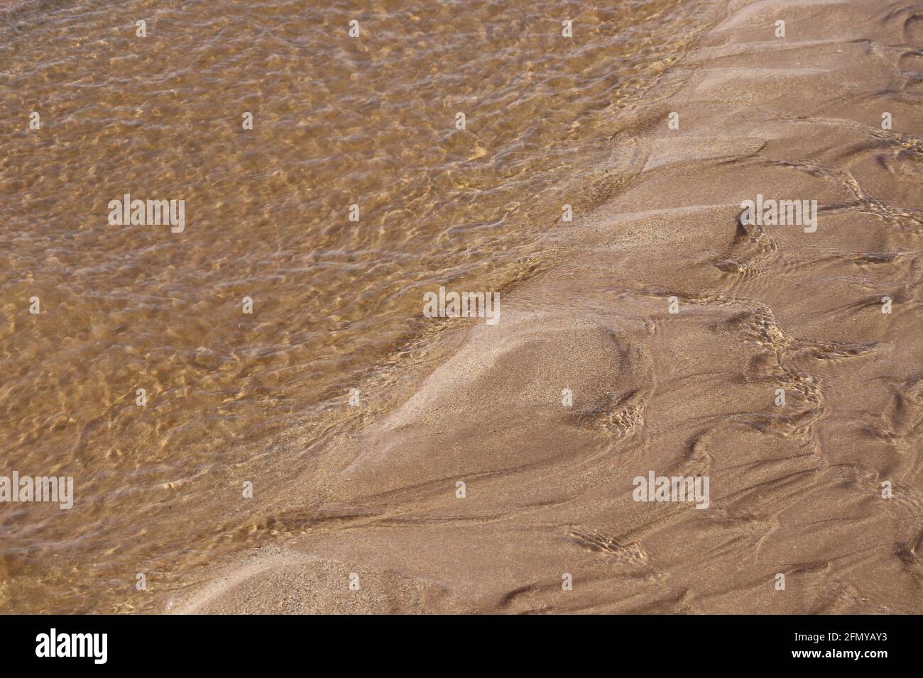 Patterns and textures in sand and sea Stock Photo - Alamy