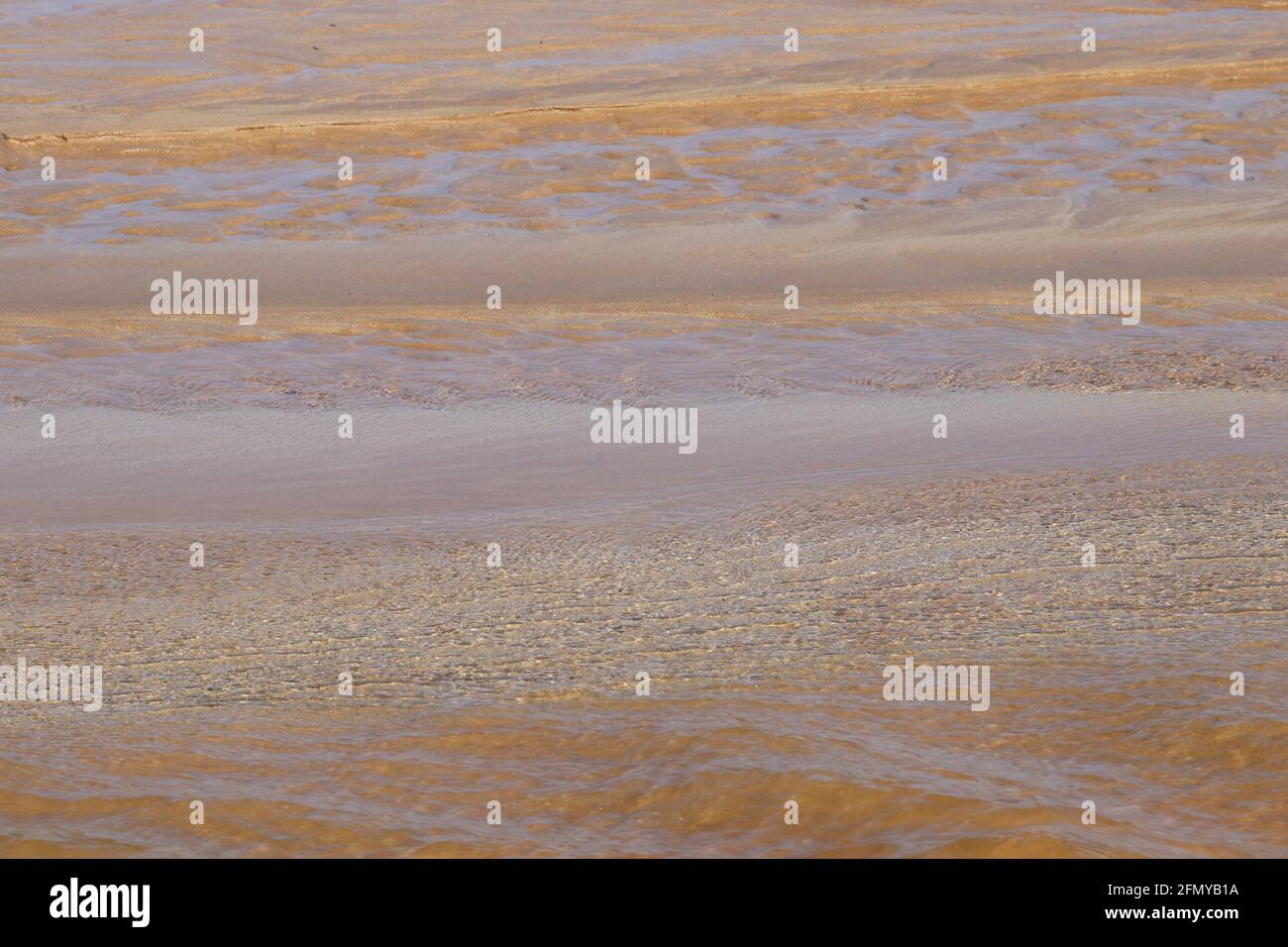 Patterns and textures in sand and sea Stock Photo - Alamy