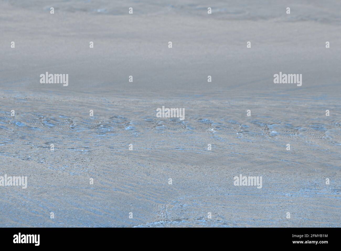Patterns and textures in sand and sea Stock Photo - Alamy