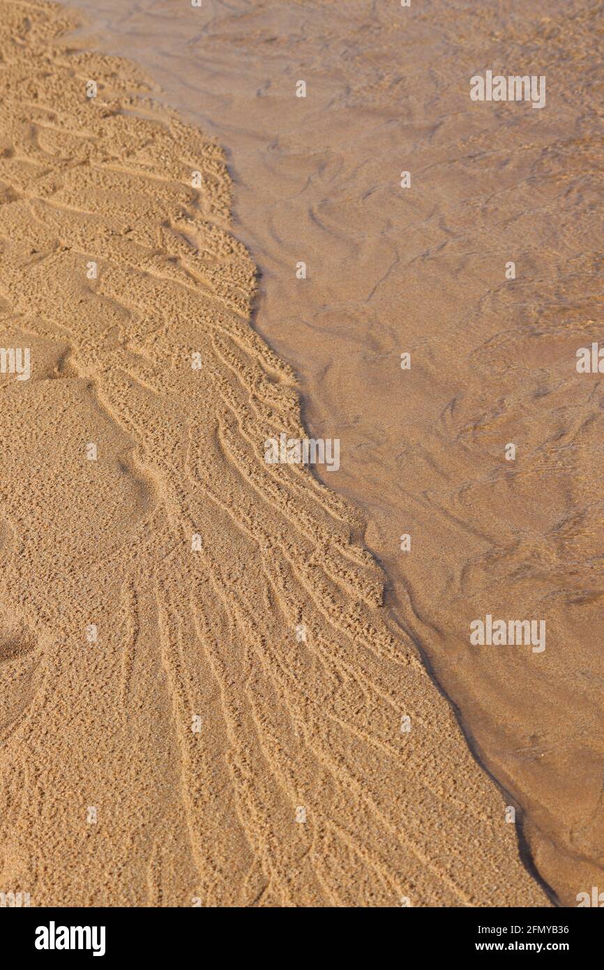 Patterns and textures in sand and sea Stock Photo - Alamy