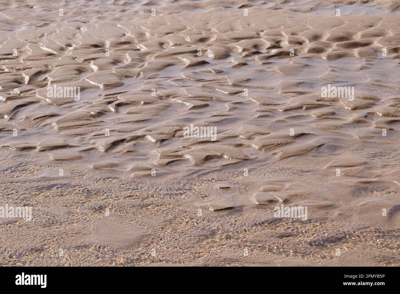 Patterns and textures in sand and sea Stock Photo - Alamy