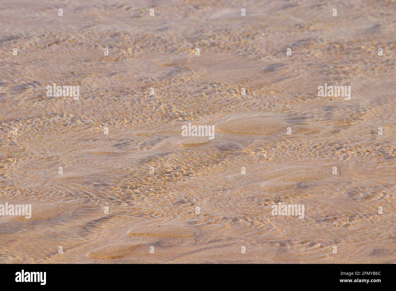 Patterns and textures in sand and sea Stock Photo - Alamy