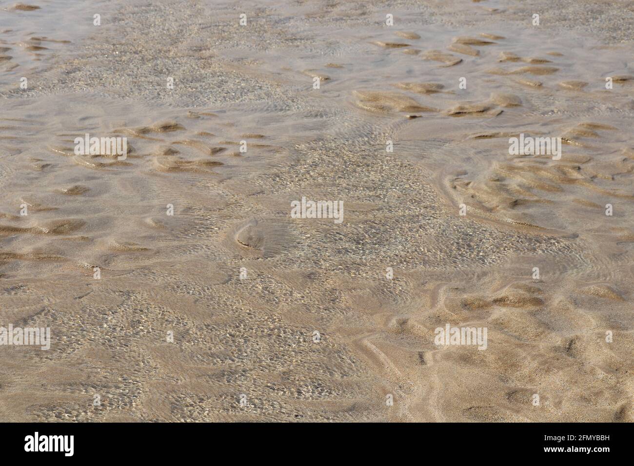 Patterns and textures in sand and sea Stock Photo - Alamy