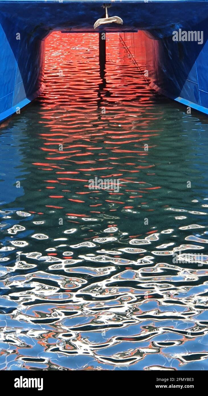 Patterns and reflections in harbour water Stock Photo - Alamy
