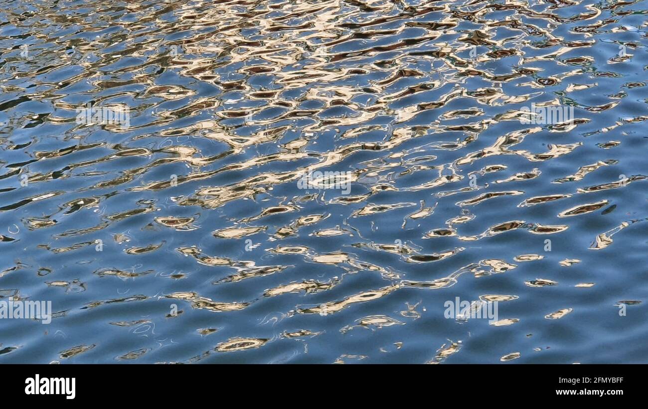 Patterns and reflections in harbour water Stock Photo - Alamy