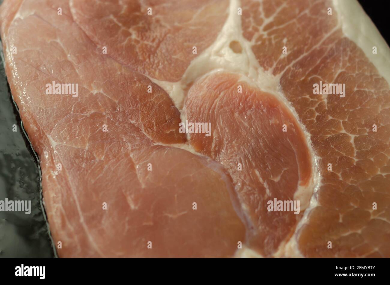 Smoked gammon steak formed from selected cuts of cured pork leg ...