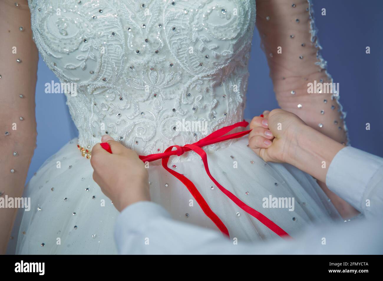 Lose the ribbon on the belly of the bride . Wedding . Bridesmaids lace ...