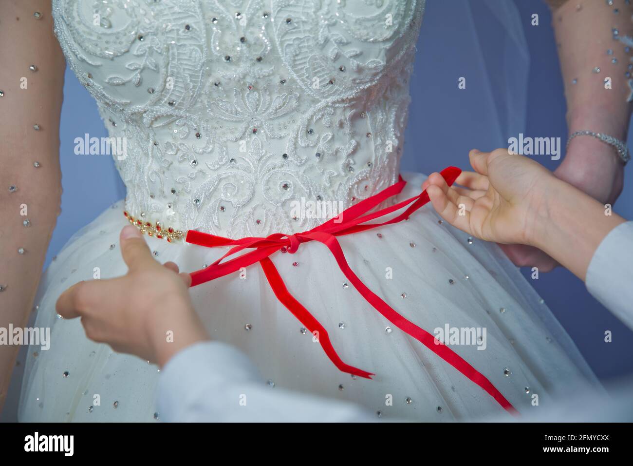 Lose the ribbon on the belly of the bride . Wedding . Bridesmaids lace ...