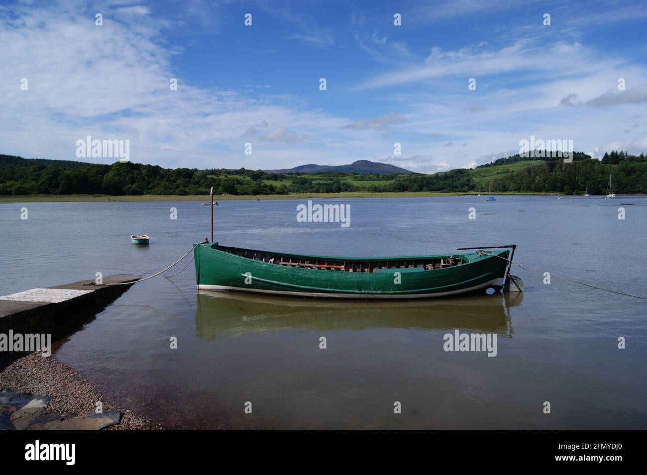 Moored Green boat Stock Photo - Alamy