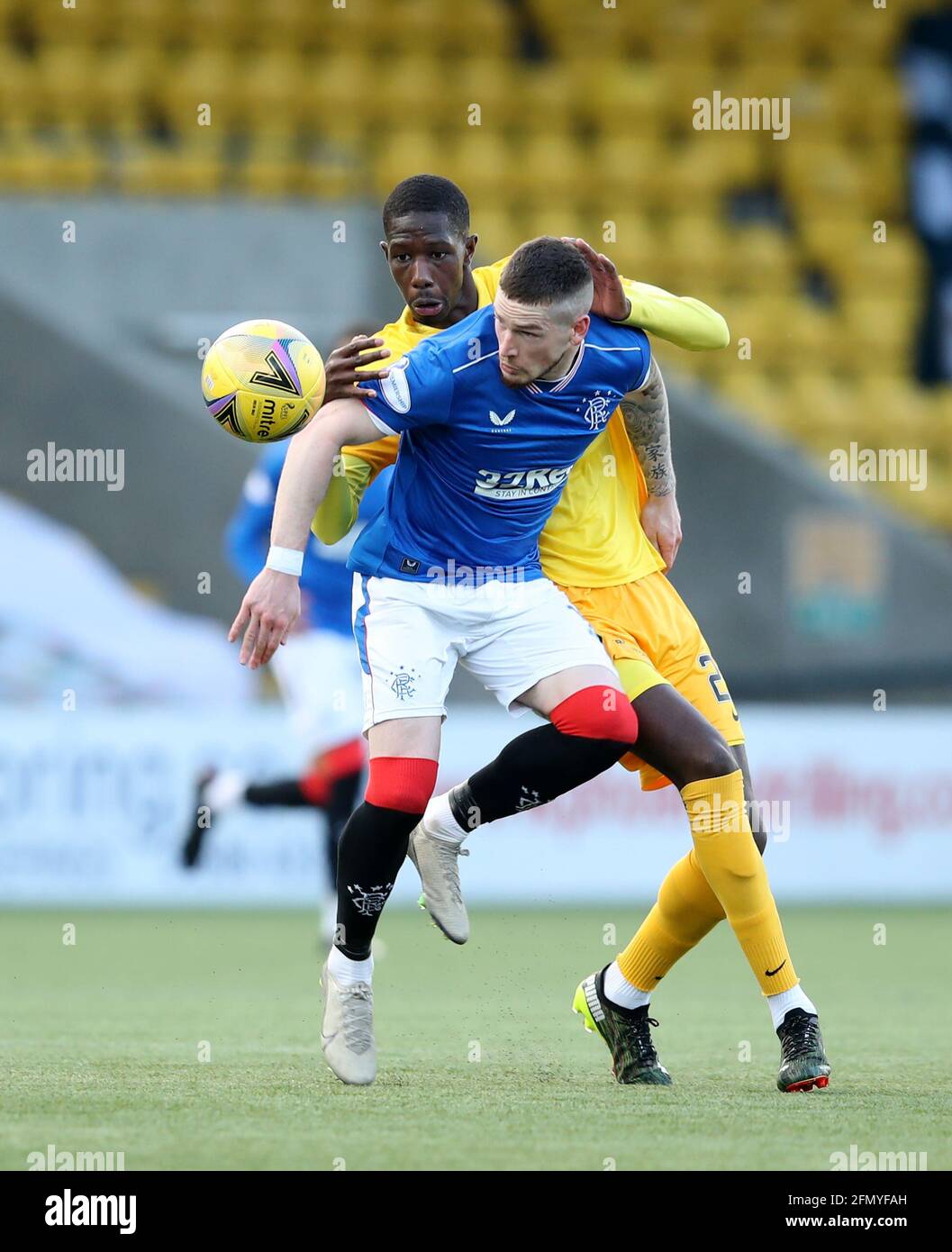 Livingston's Djibri Diani (right) and Rangers' Ryan Kent (left) battle ...